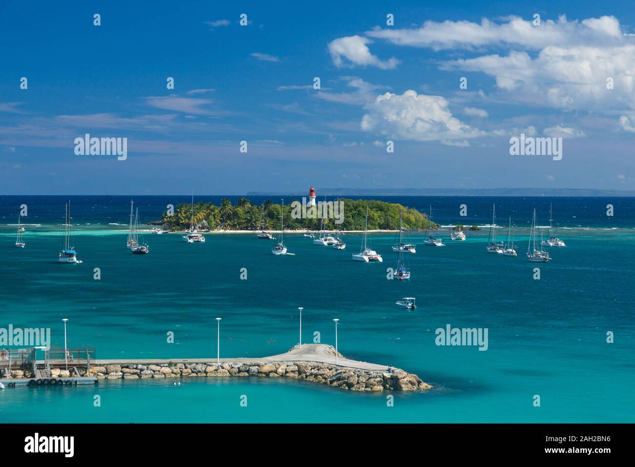 Sailboats at anchor by the Ilet Du Gosier Lighthouse as seen from ...
