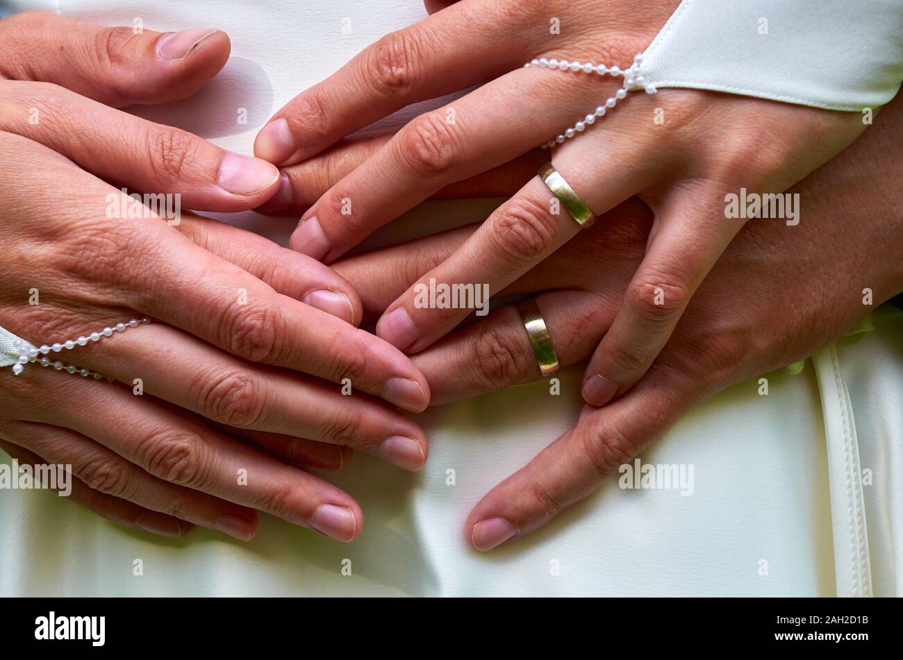 wedding couple hand in hand Stock Photo - Alamy