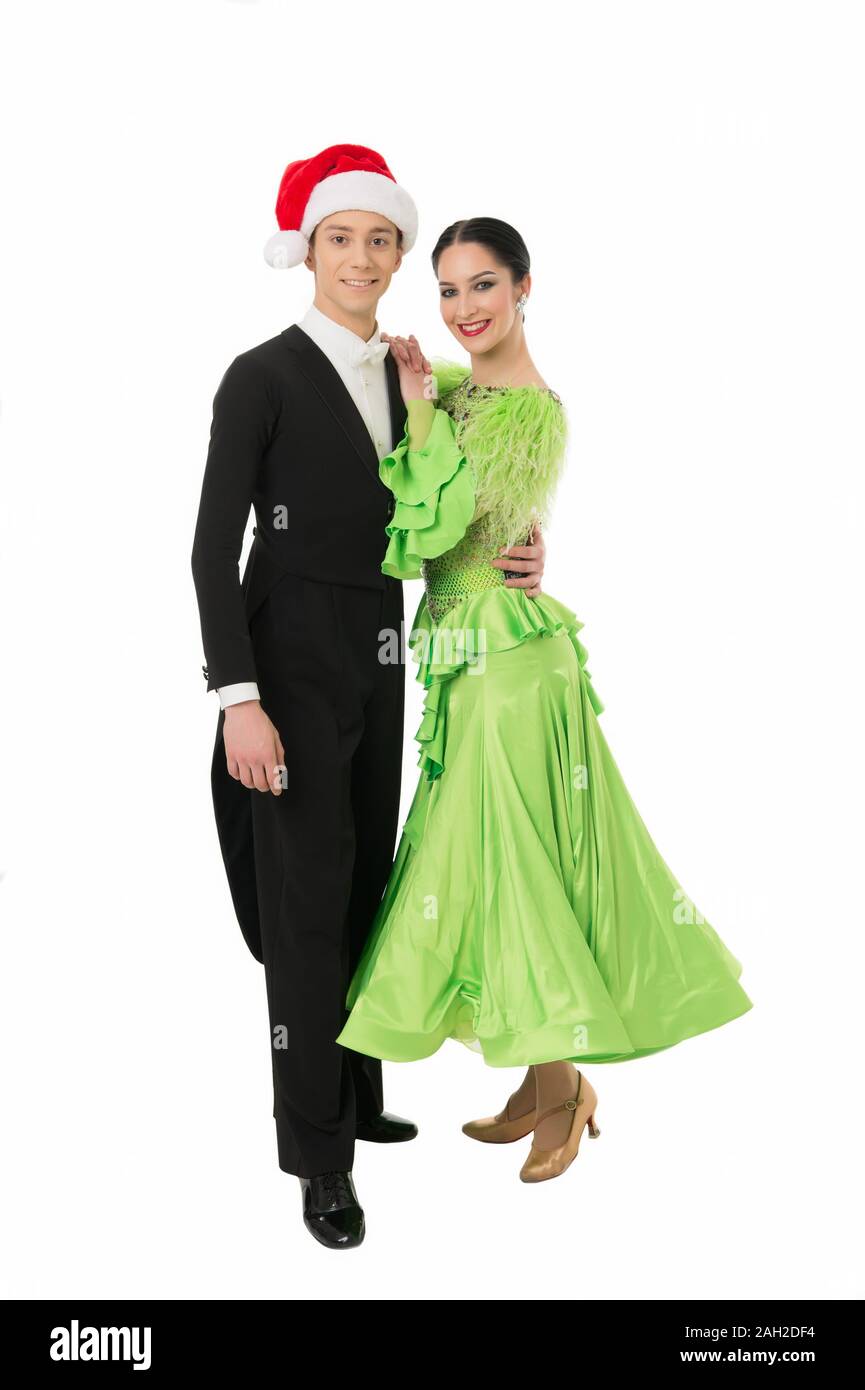 winter waltz. happy couple of dancers celebrate xmas. tuxedo man in ...