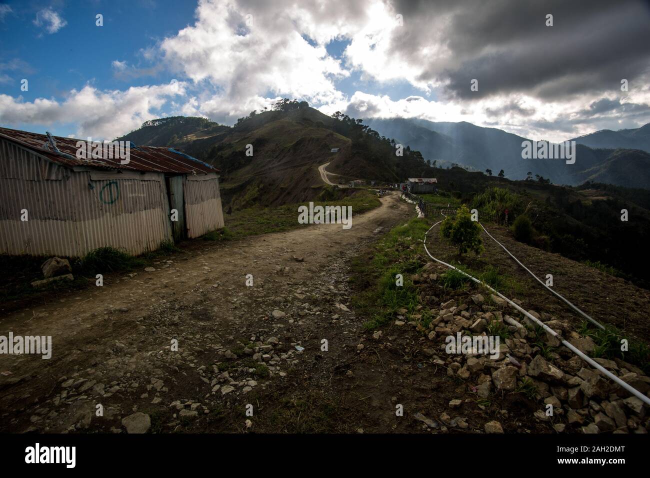 dramatic angle image of a small shack in a village high in the ...