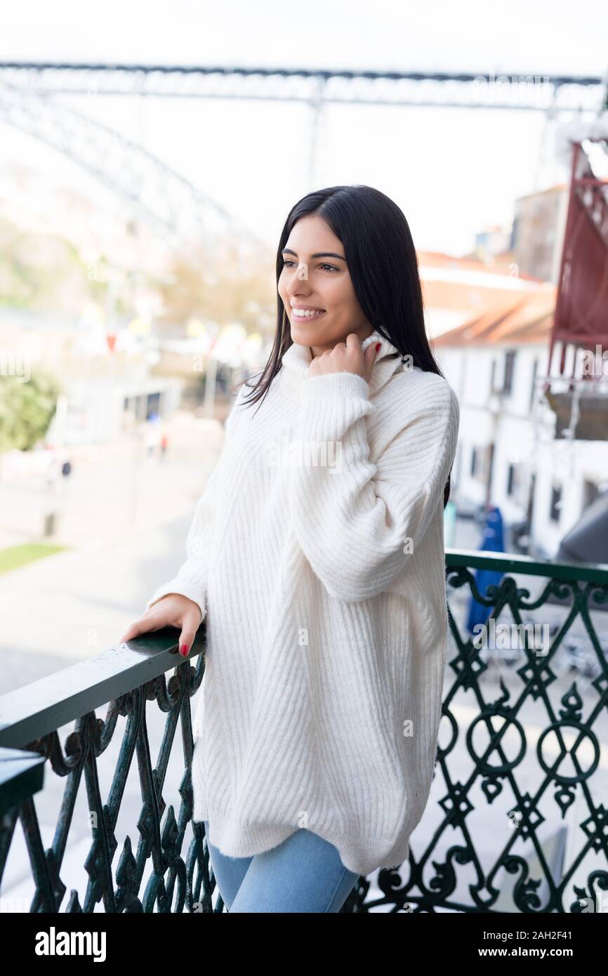 Woman relaxing at balcony enjoying sunrise. Good morning Stock Photo ...