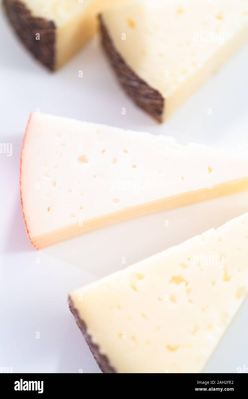 Variety of large wedges gourmet cheese on a white background Stock ...
