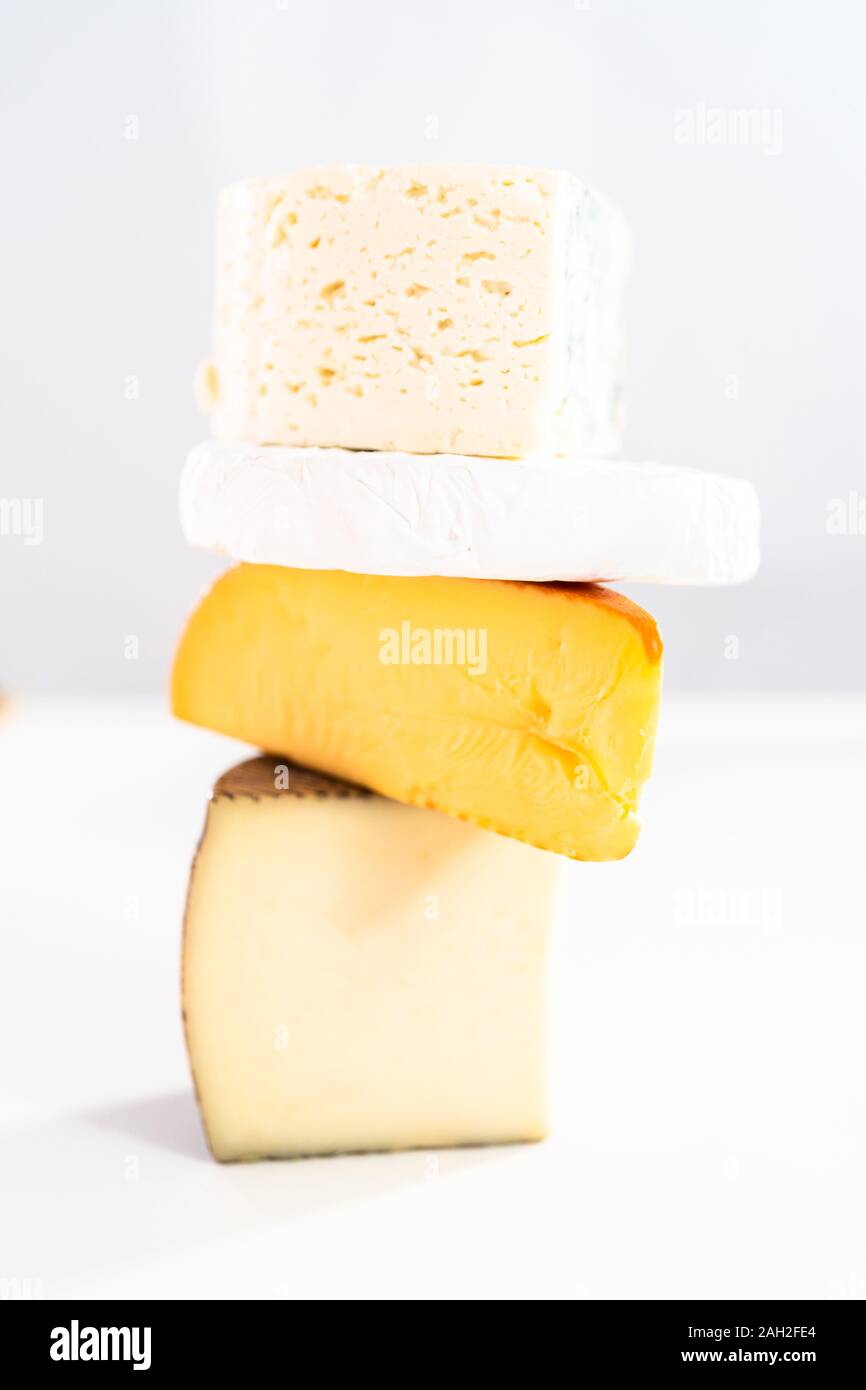 Variety of large wedges gourmet cheese on a white background Stock ...