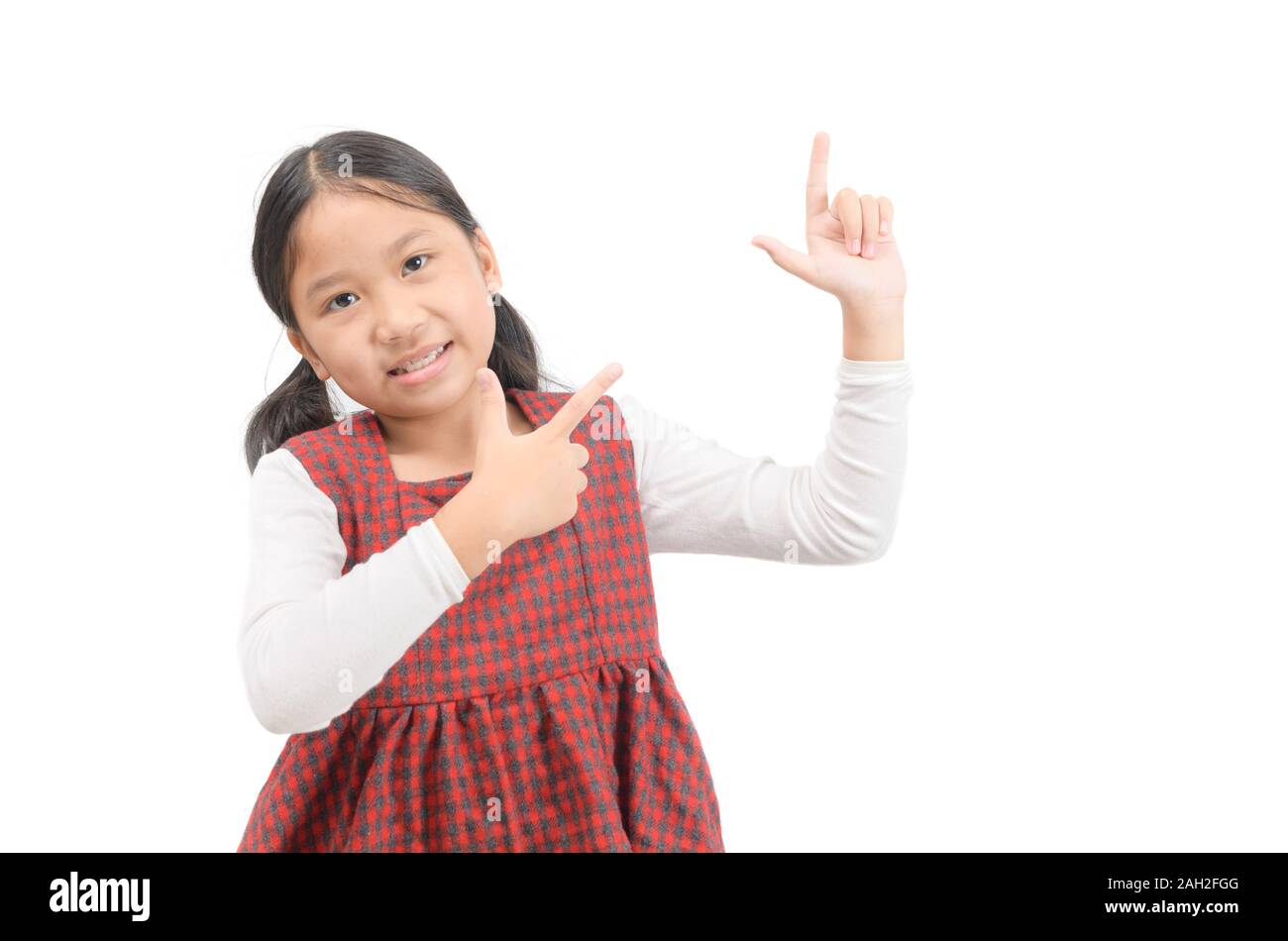 Cute girl pointing hi-res stock photography and images - Alamy