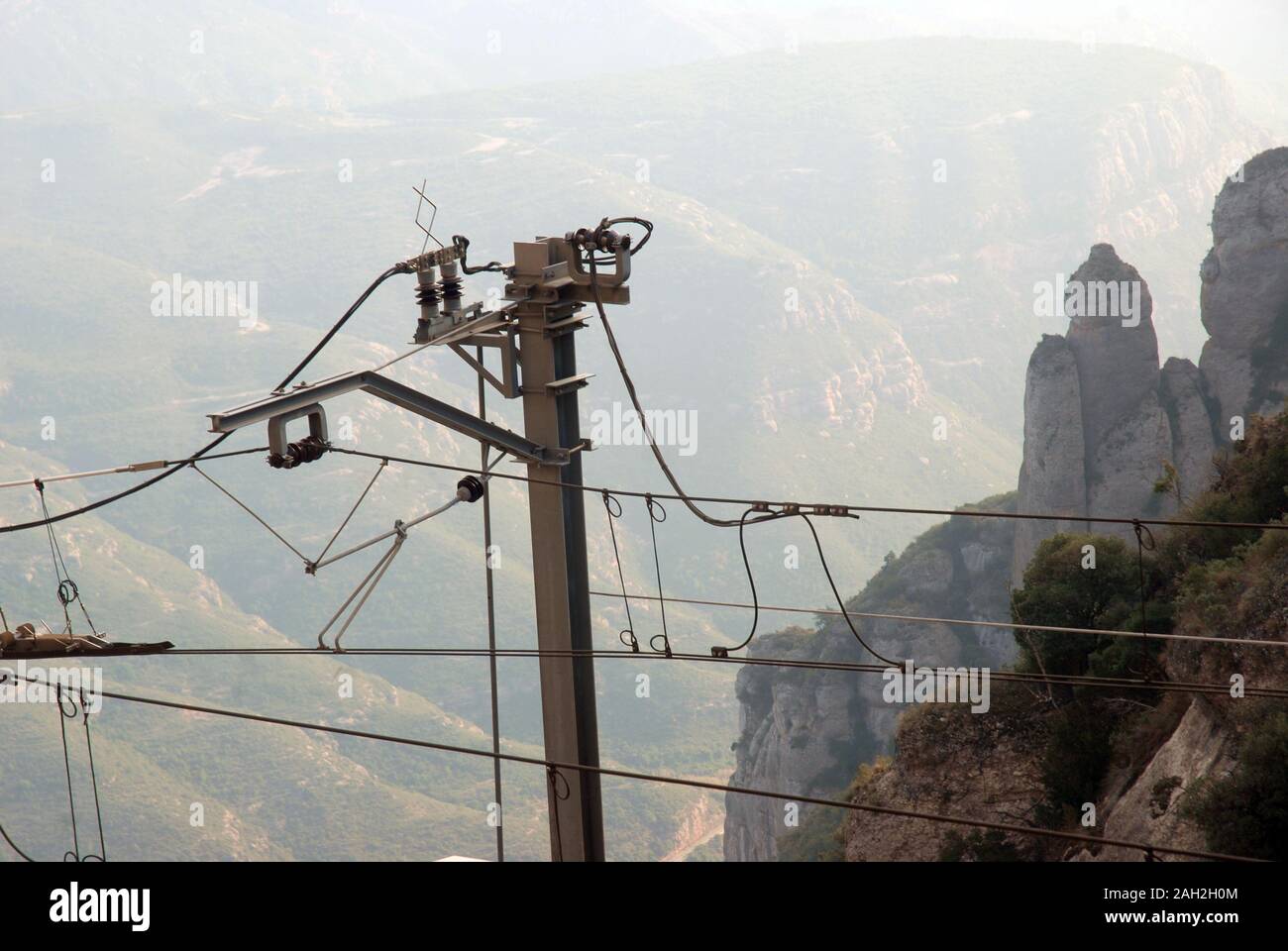 Train pylon and mountains surrounding the Monserrat Monastery ...