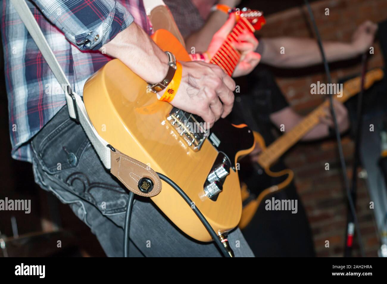 A live performance by a rock group of musicians at an upscale ...