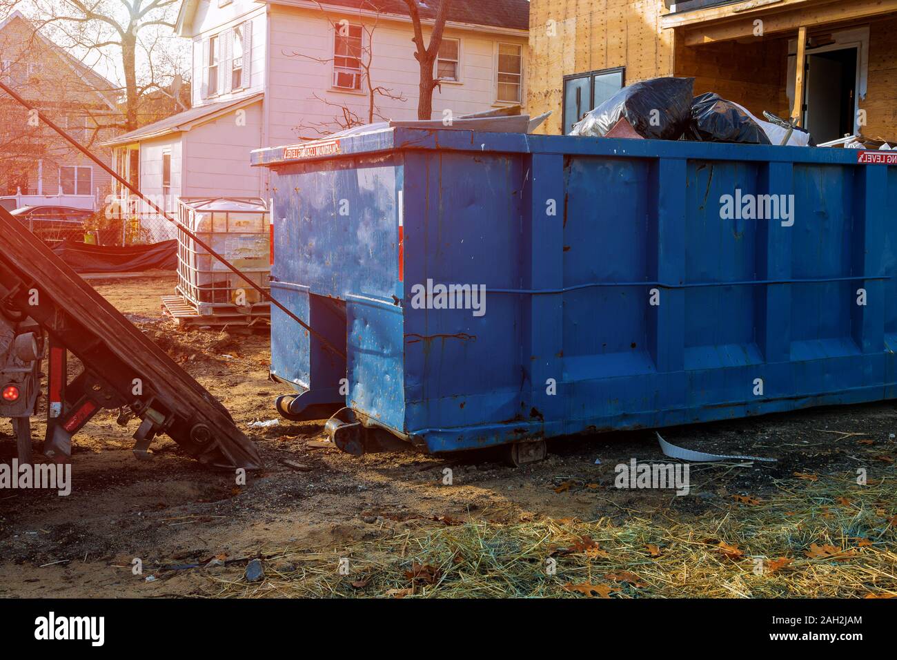 Loading the garbage container construction material and used in the ...