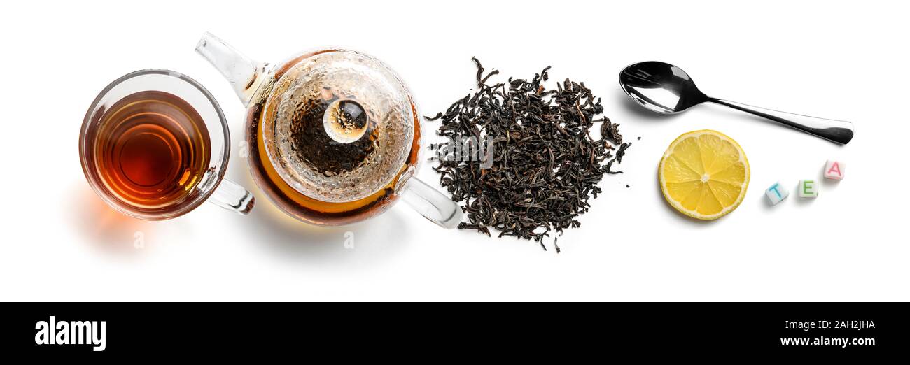 Black tea and accessories top view on white background Stock Photo - Alamy