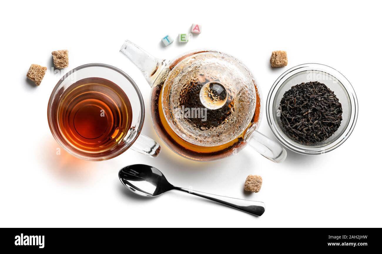 Black tea and accessories top view on white background Stock Photo - Alamy