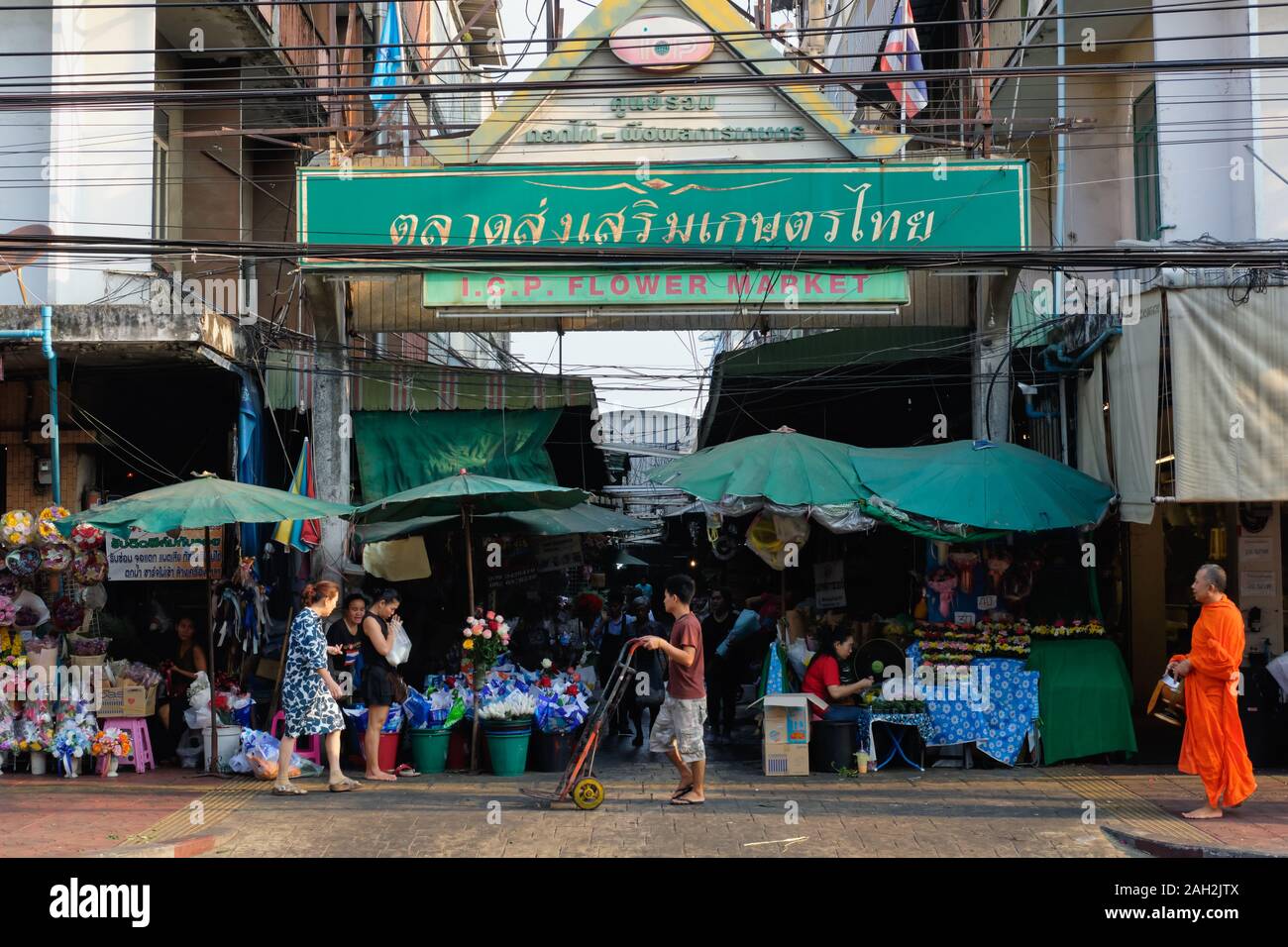 In Pak Klong Talaat (Talad) market area in Bangkok, Thailand, a woman ...
