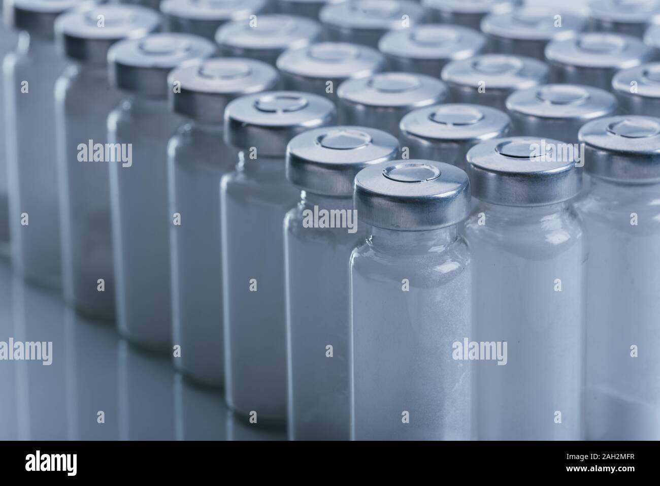 Glass medical ampoule vial for injection. Medicine is dry white drug ...