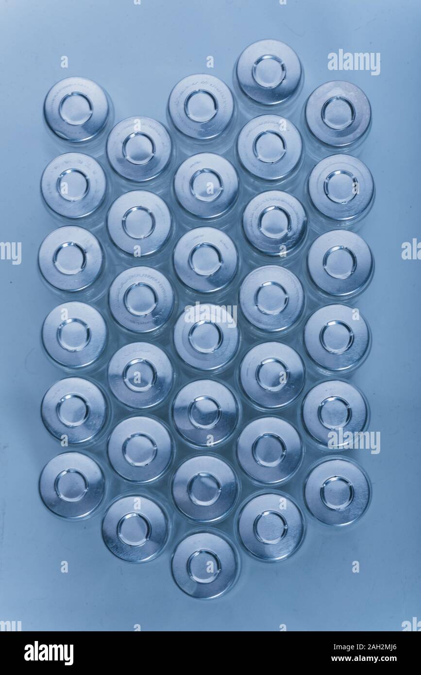 Glass medical ampoule vial for injection. Medicine is dry white drug ...