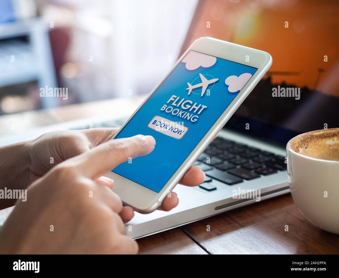 Flight booking online with smartphone. Finger touching on mobile phone ...