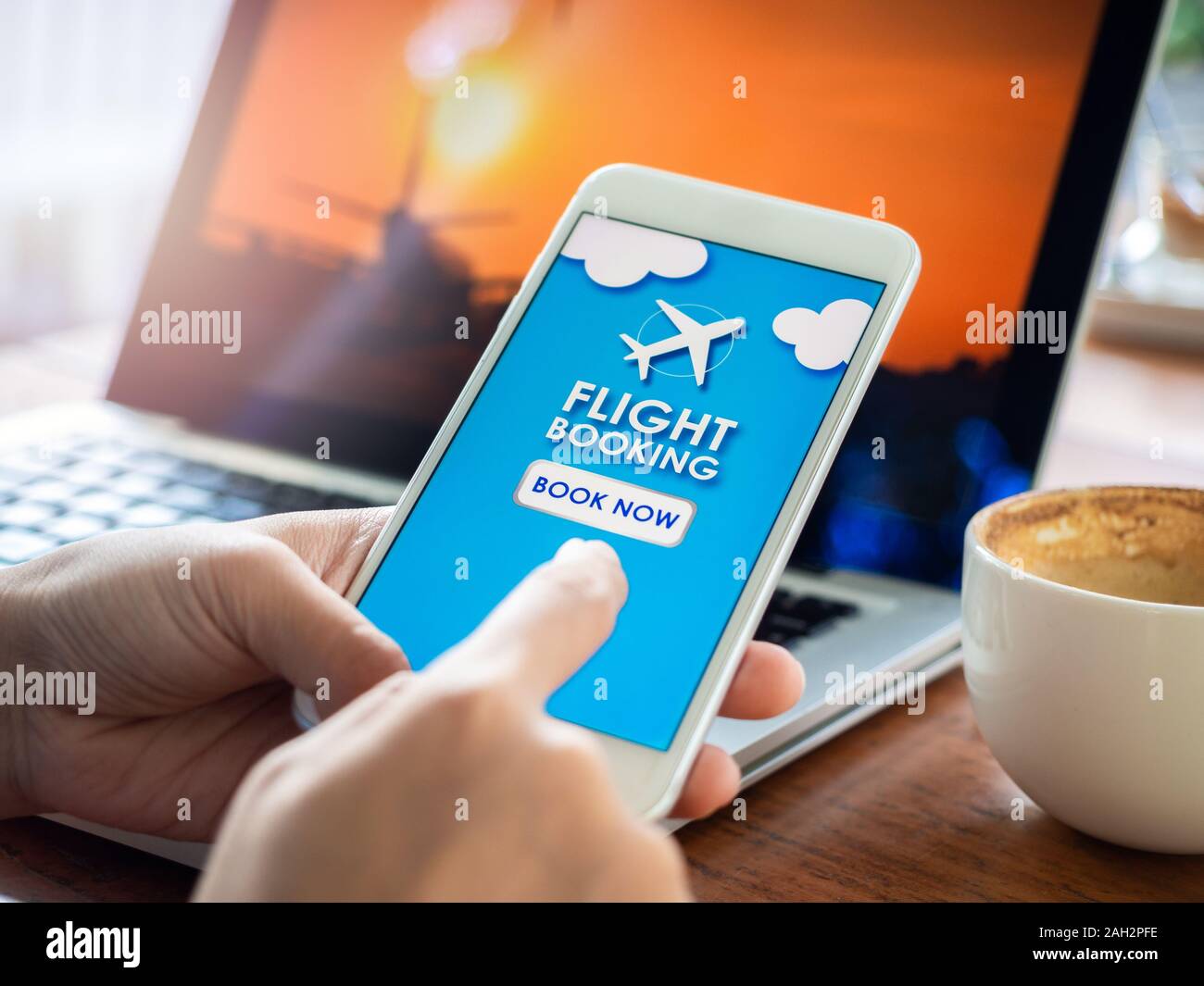 Flight booking online with smartphone. Finger touching on mobile phone ...