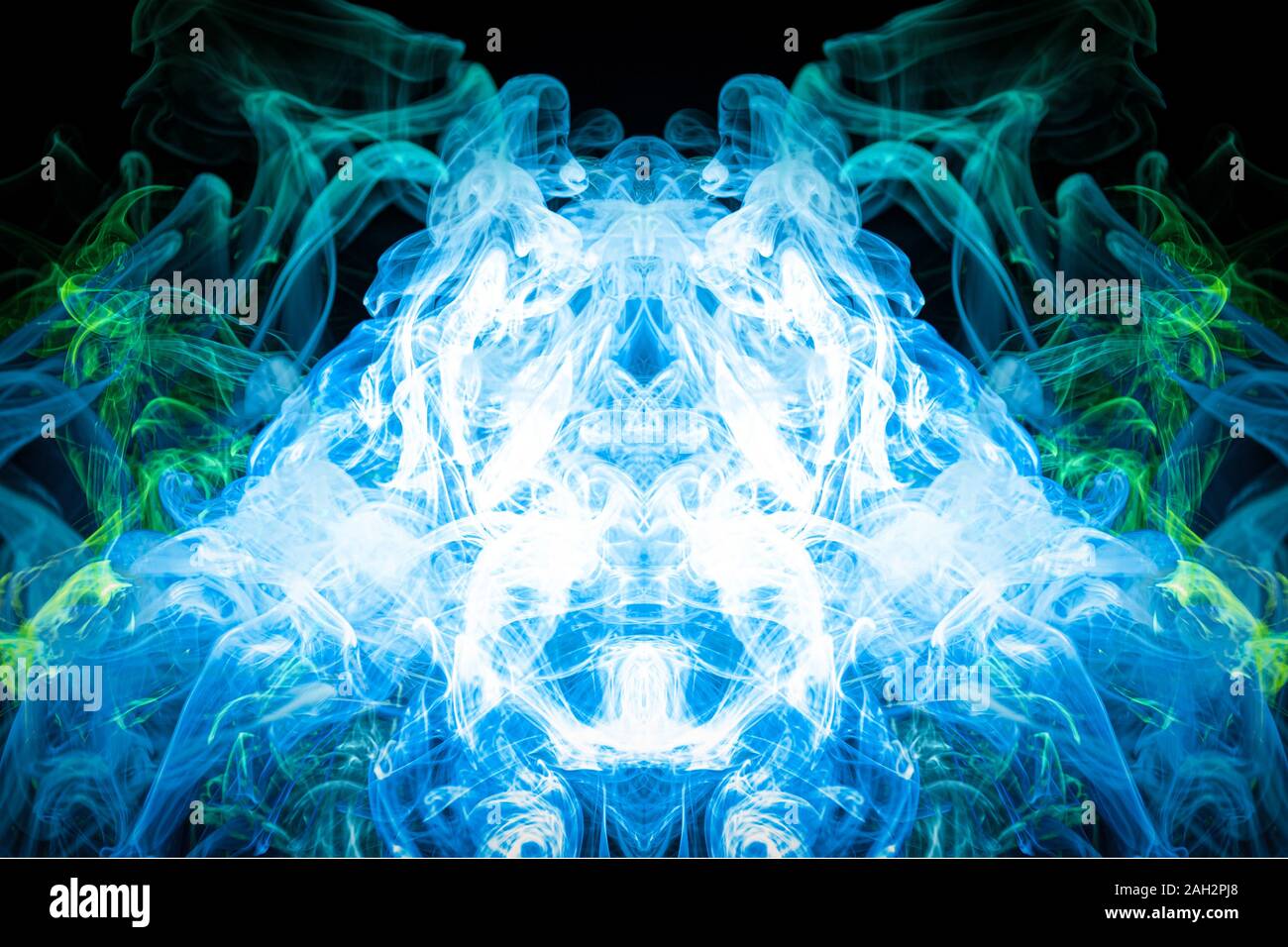 Smoke of pattern green and blue in the form of horror monster on a dark ...
