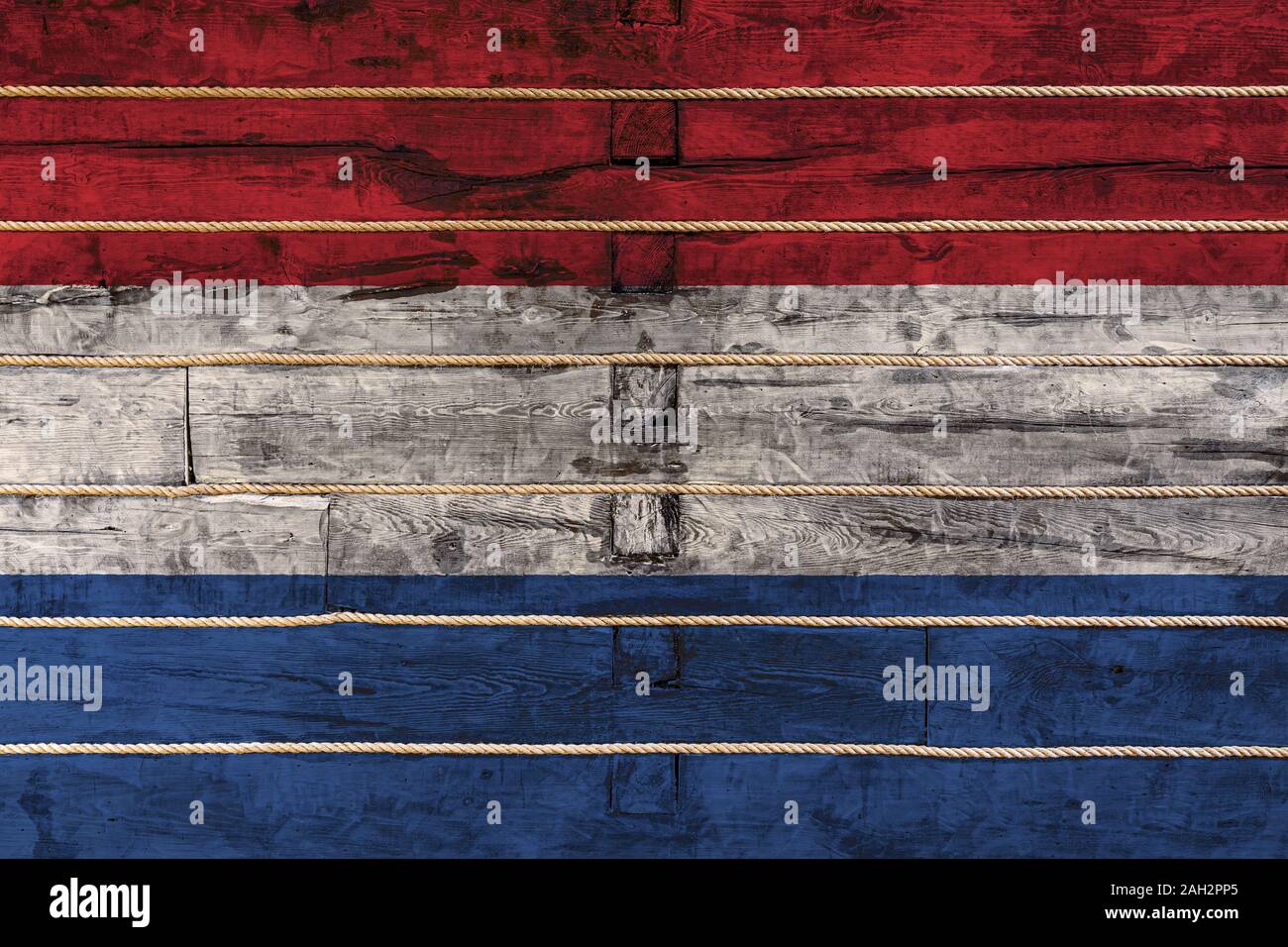 National flag of Netherlands on a wooden wall background. The concept ...