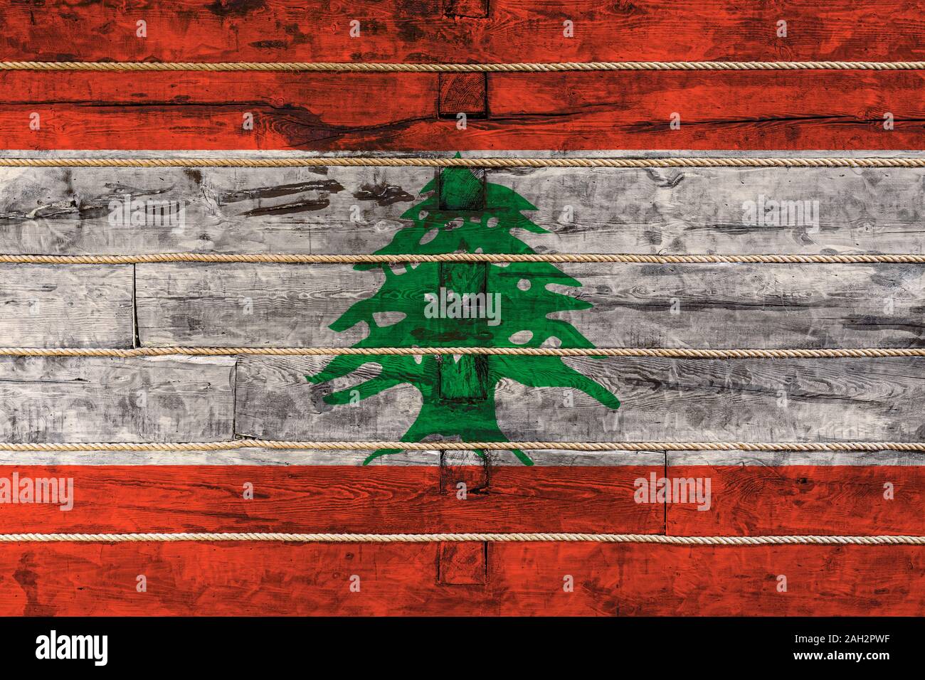 National flag of Lebanon on a wooden wall background. The concept of ...