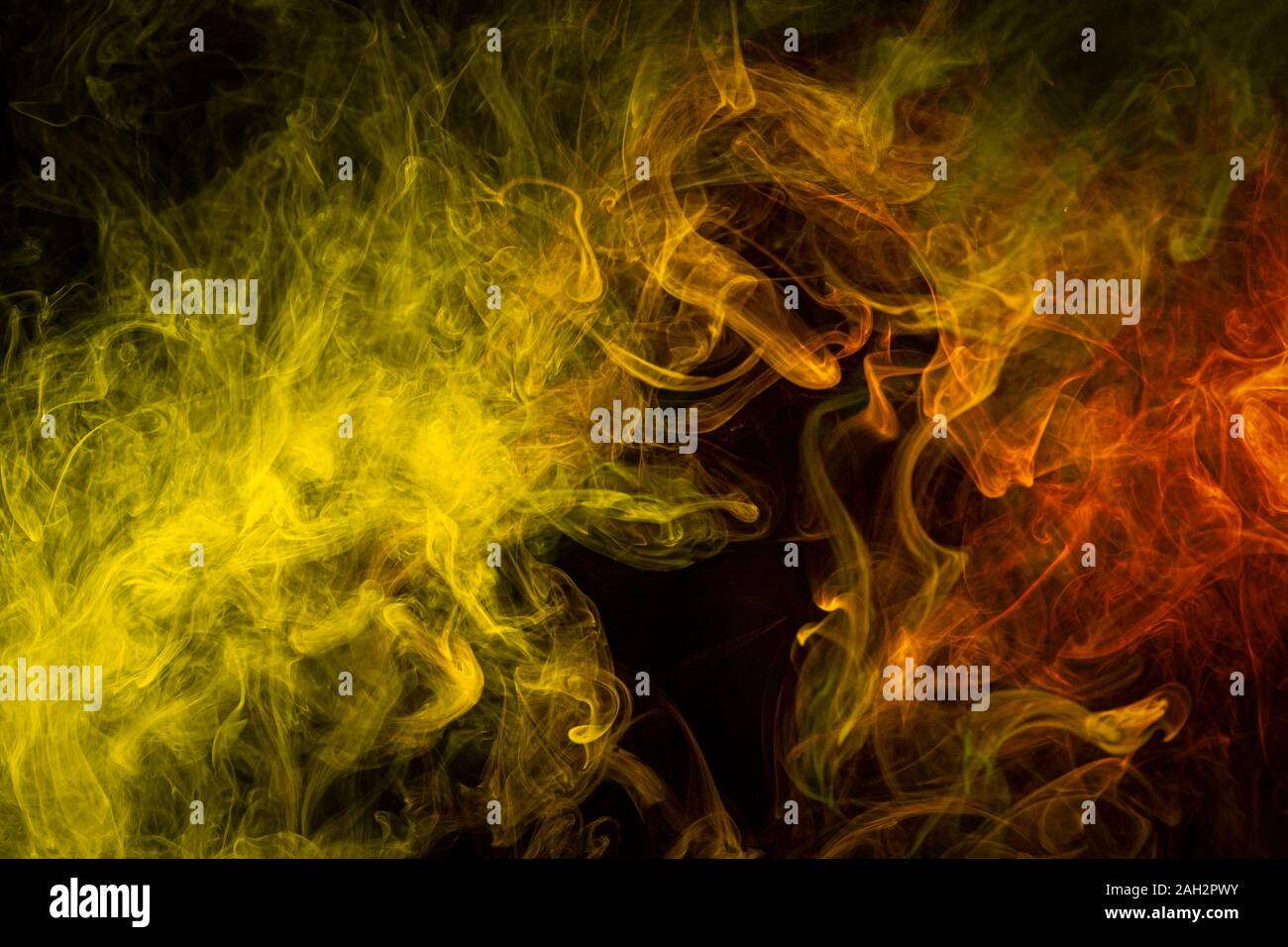 Pattern, Neon yellow and orange smoke in the on a dark isolated ...
