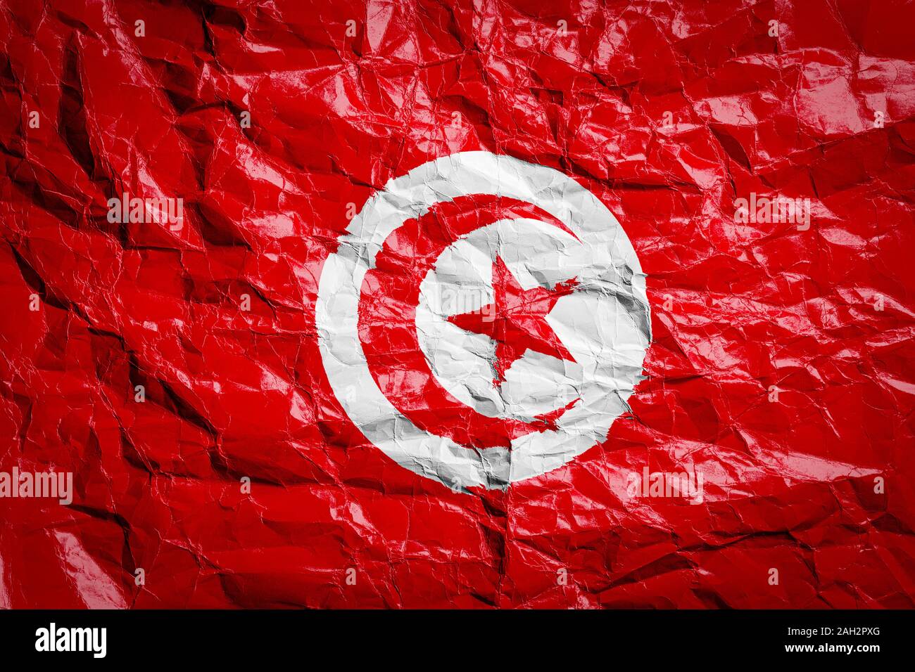 National flag of Tunisia on crumpled paper. Flag printed on a sheet ...