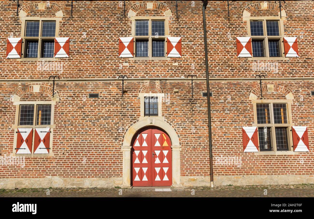 Red door of the historic castle in Raesfeld, Germany Stock Photo - Alamy