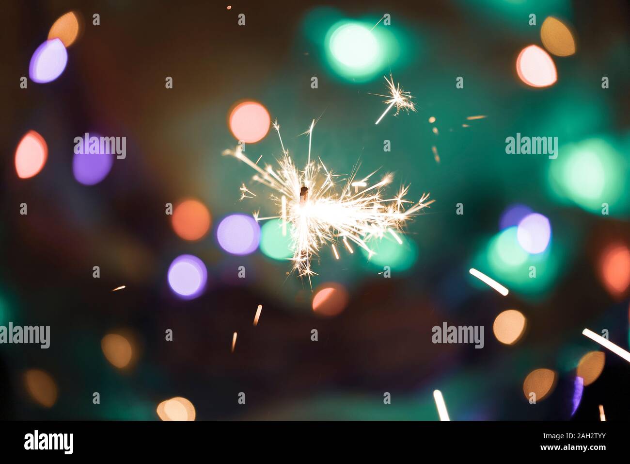 Sparkler burning sparks in hand hi-res stock photography and images - Alamy
