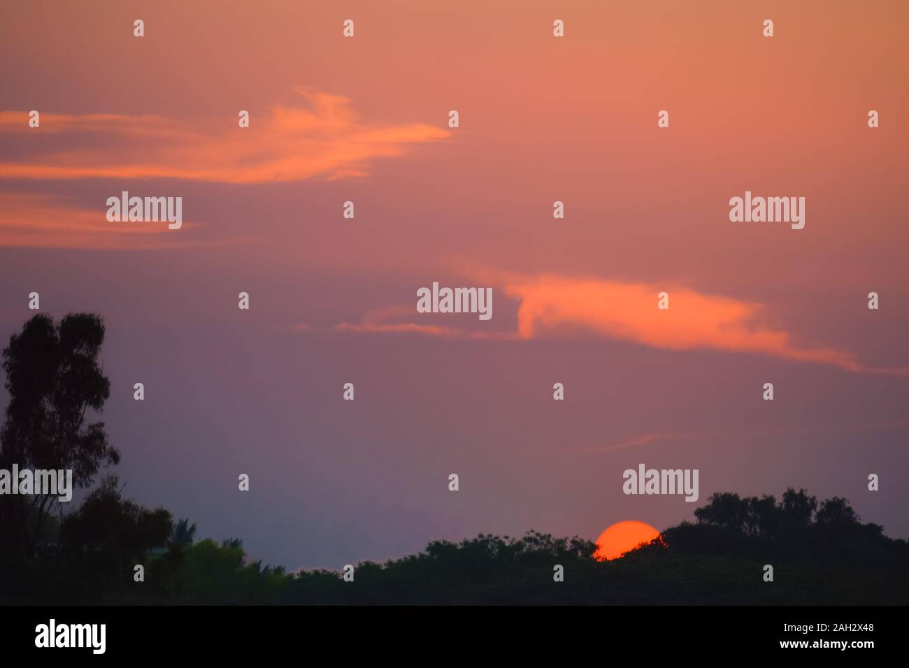 Sun setting in Lal Bagh, Bangalore. Minimalistic sunset with a vast ...