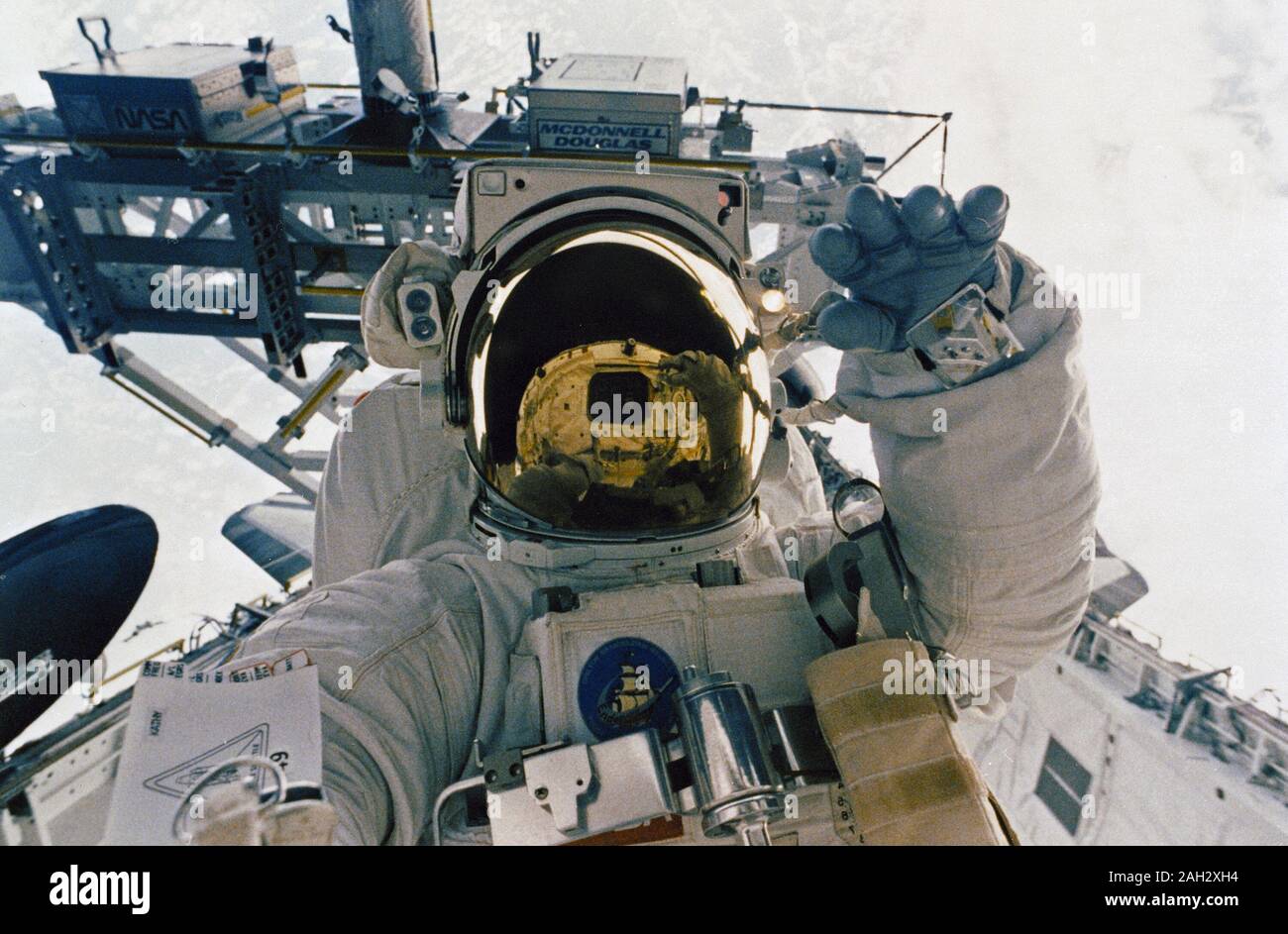 1992 - In this onboard photo, astronaut Kathryn Thornton is working on ...