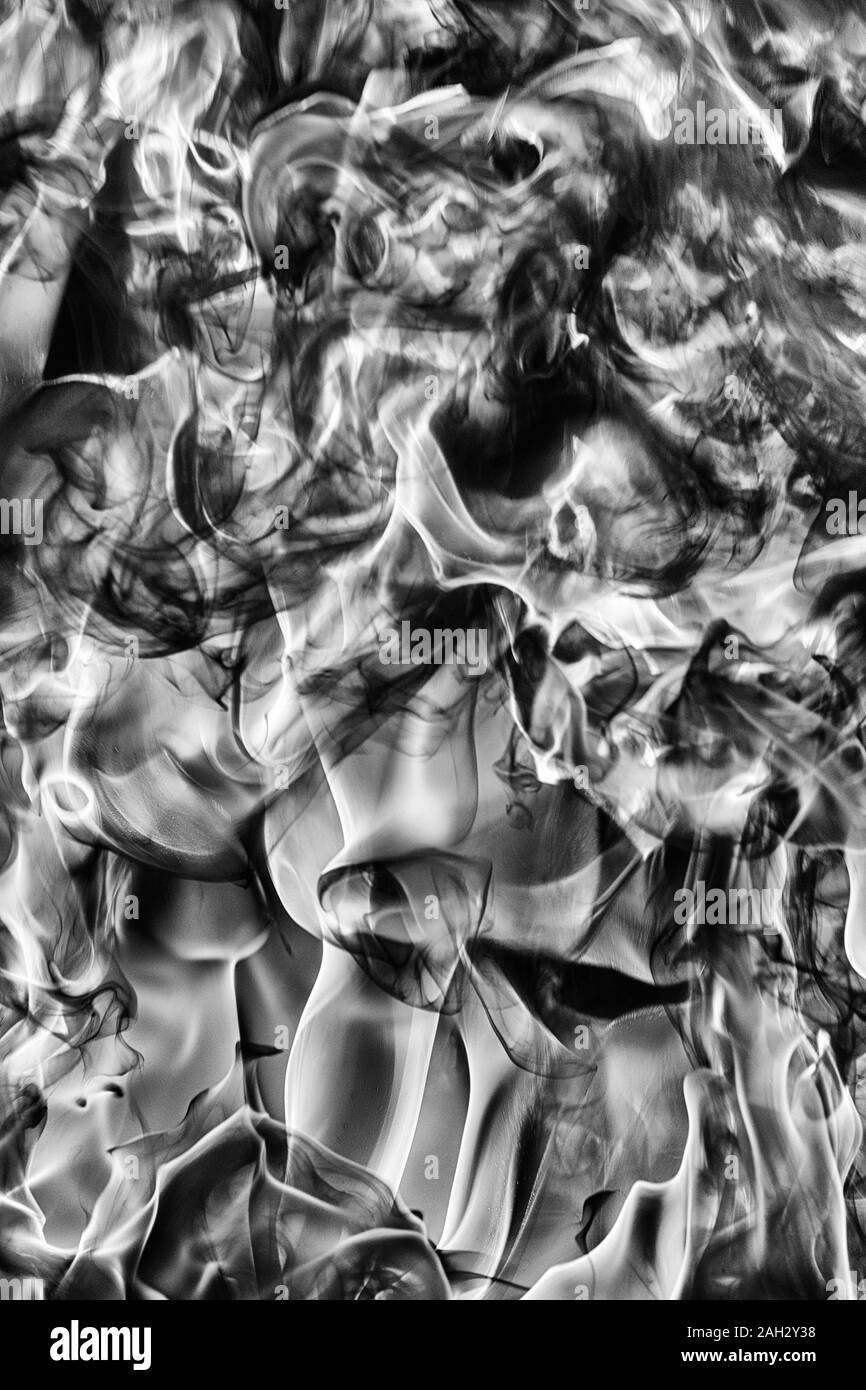 Abstract clouds of natural black smoke and white huge flame of strong ...