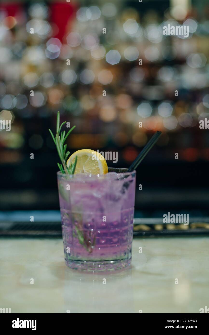 purple bar cocktail of lemon and ice Stock Photo - Alamy