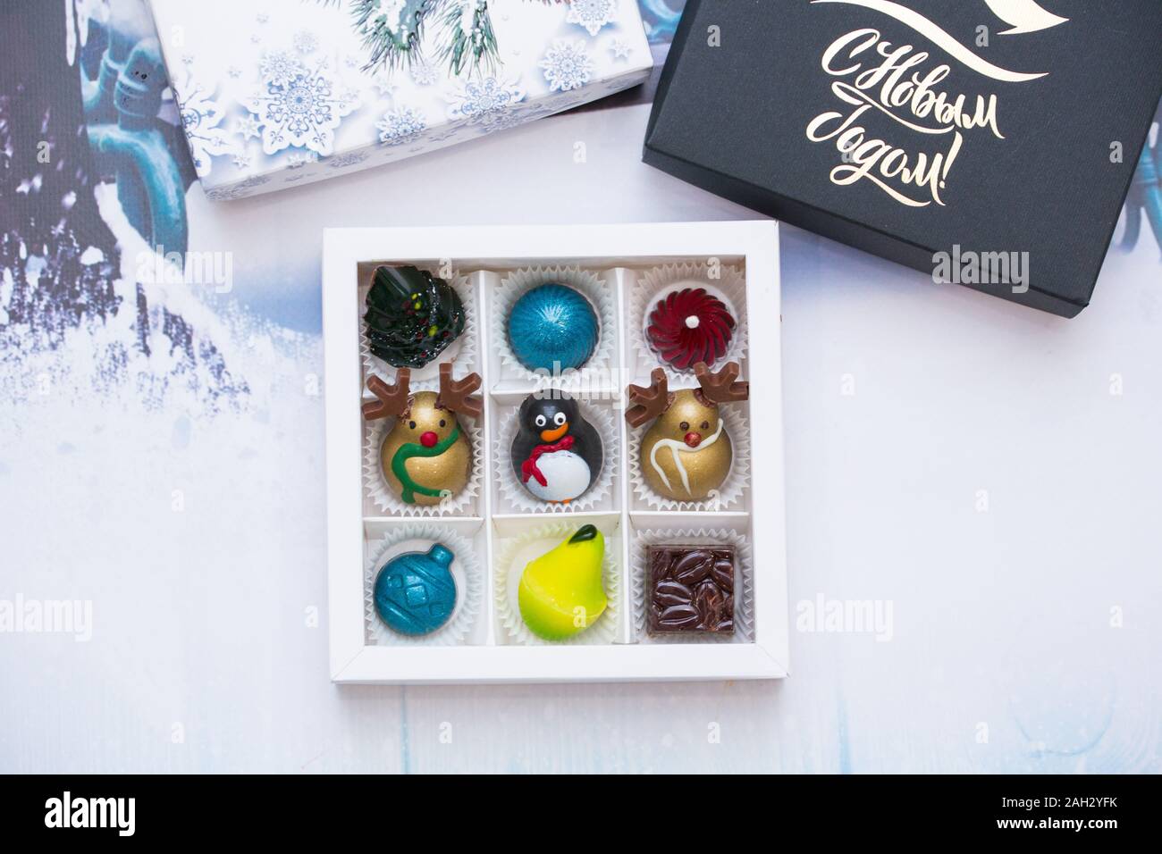 assortment of multi-colored exquisite chocolates, white, dark and milk ...