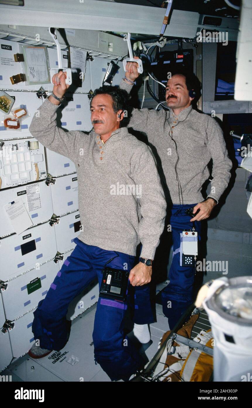 STS-35 Mission Specialist (MS) Jeffrey A. Hoffman (front) and Pilot Guy ...
