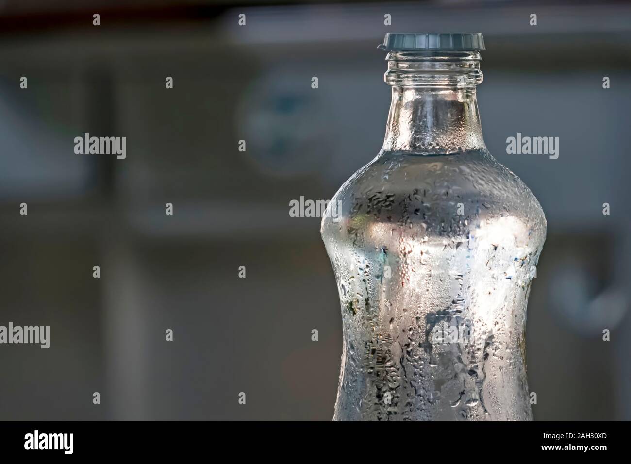 drinkable cold water in a glass bottle Stock Photo - Alamy