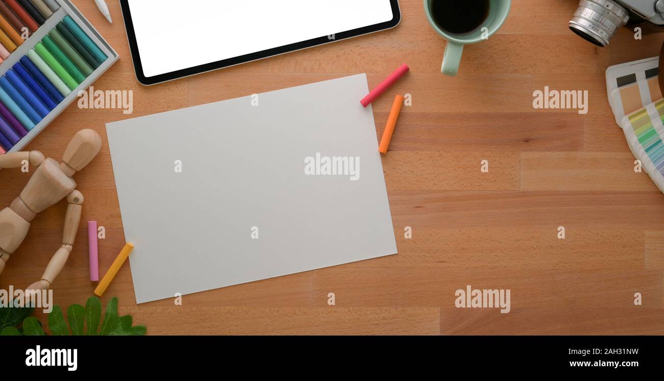 Top view of professional artist workplace with sketch paper and ...