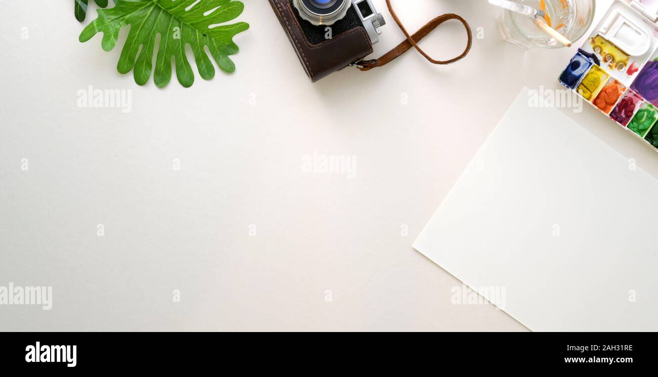 Top view of comfortable artist workplace with sketch paper and painting ...