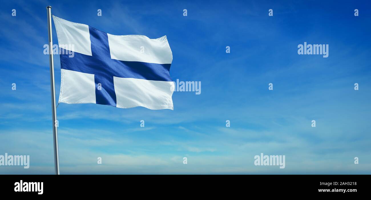 The National flag of Finland blowing in the wind in front of a clear ...