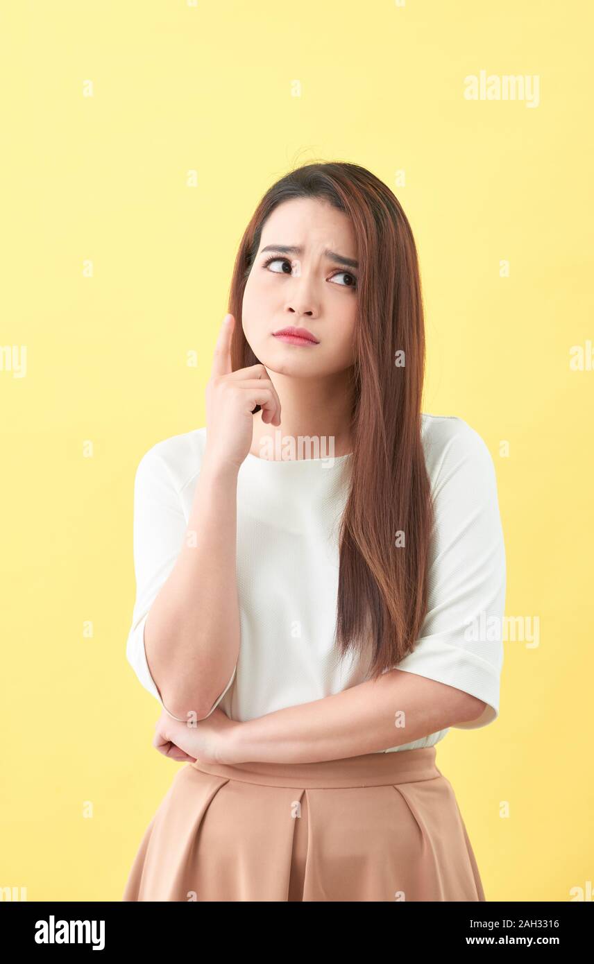 confused young girl thinking and looking up Stock Photo - Alamy