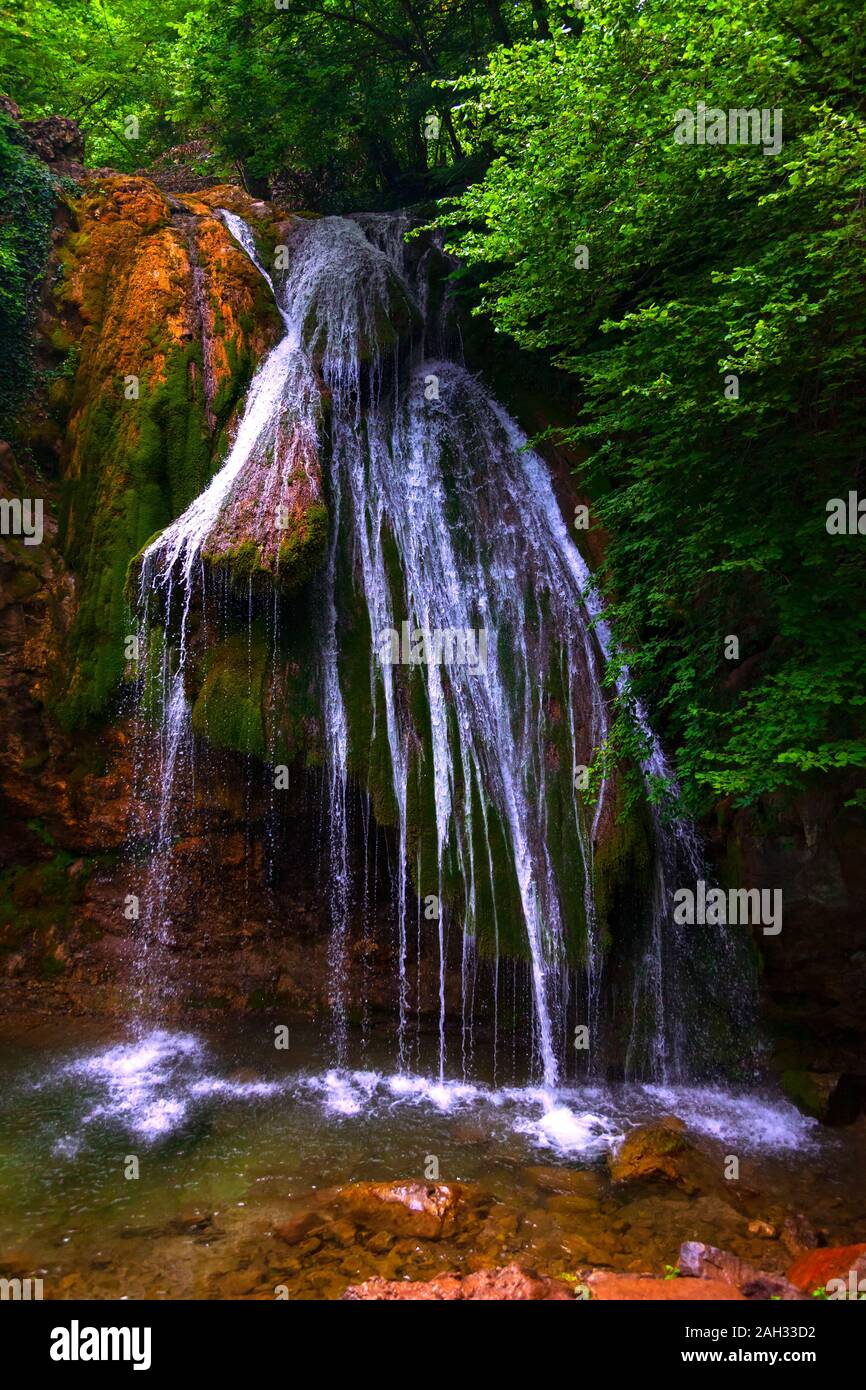 Beautiful waterfall in a deep forest Stock Photo - Alamy