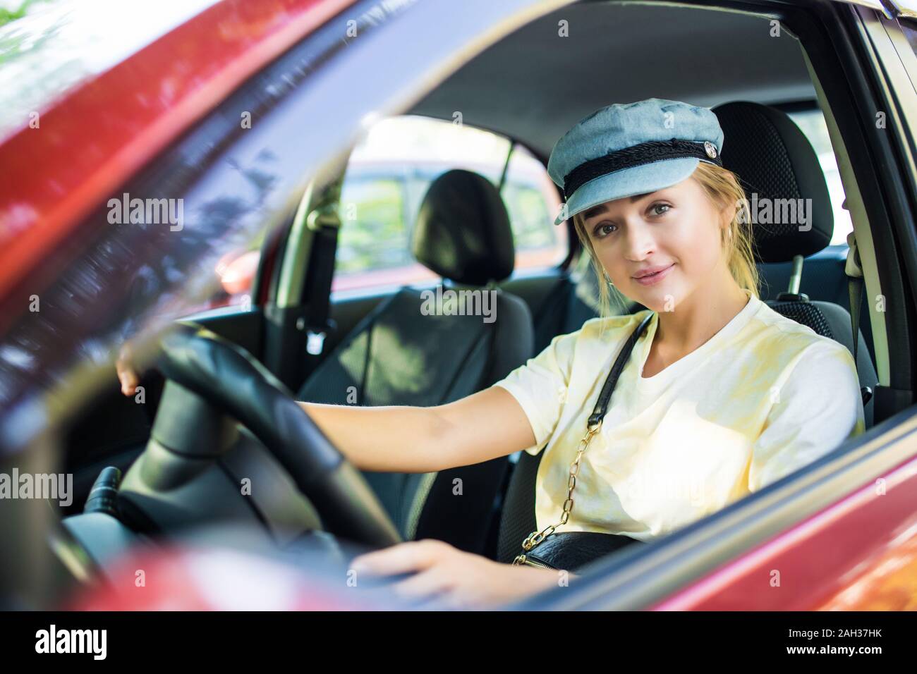 Side View Of A Young Happy Woman Driving Car Stock Photo - Alamy