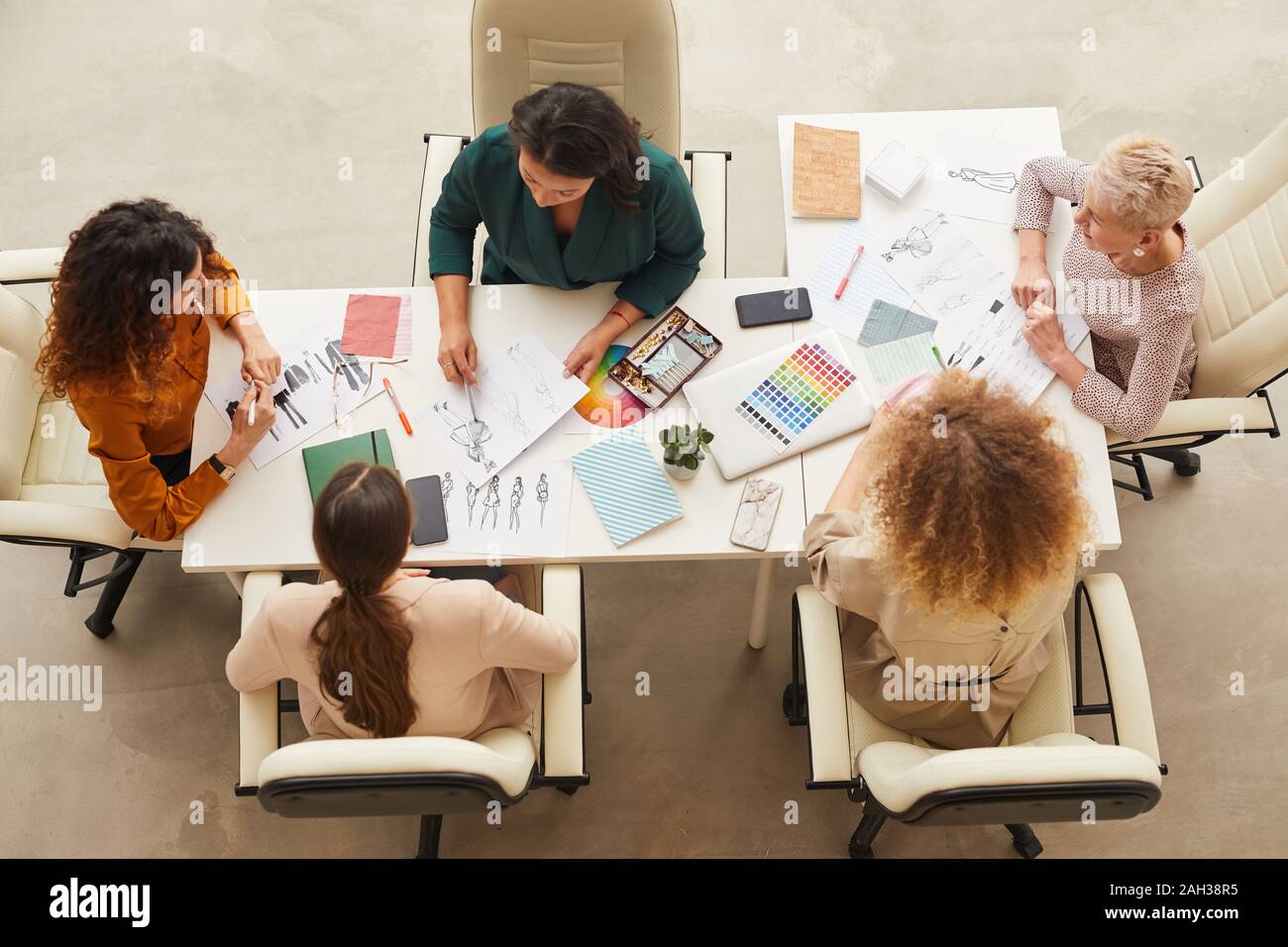 Horizontal top view shot of five stylish women creating fashionable ...
