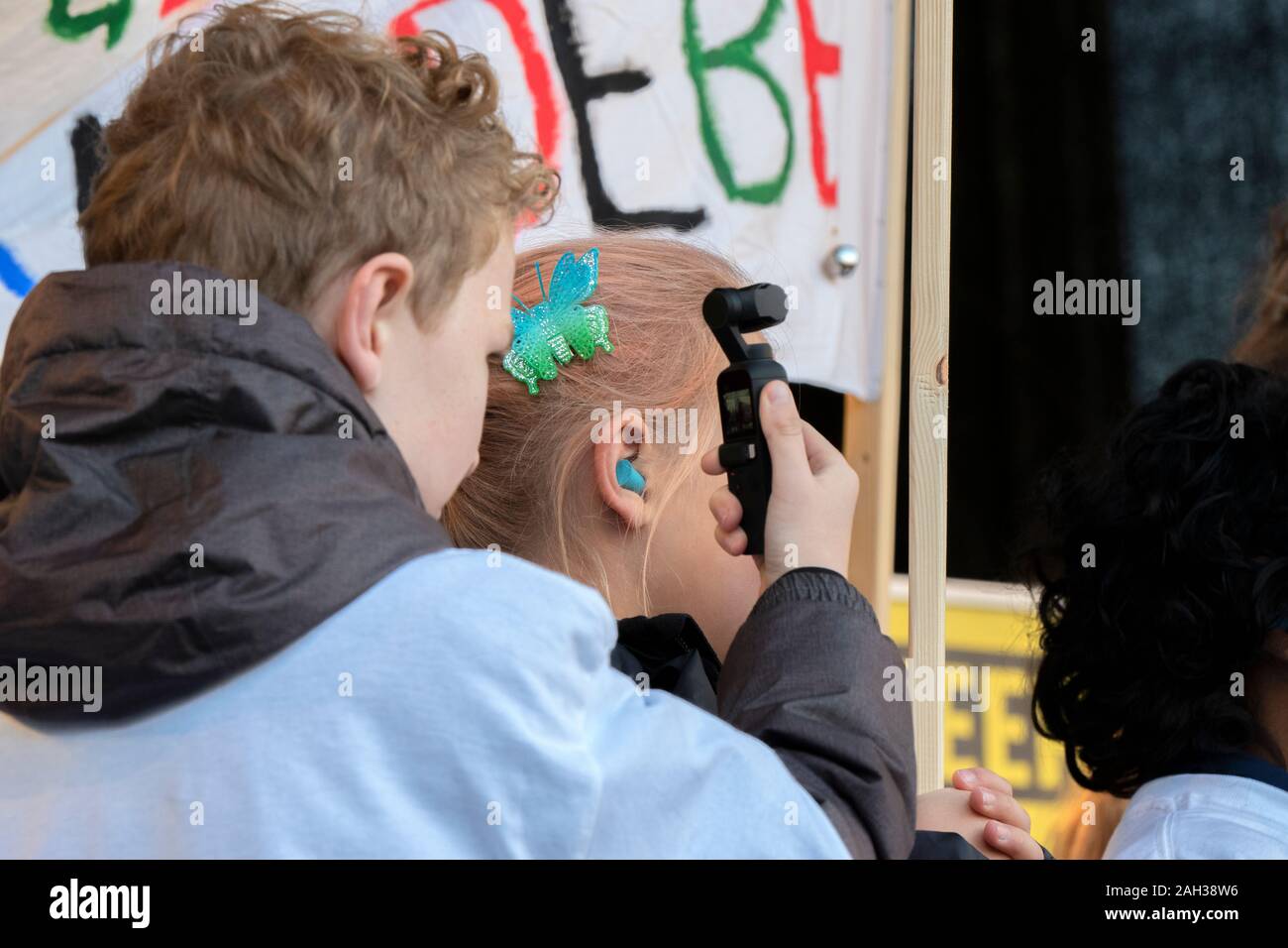 Young Boy Filming At The Demonstration For A Better Education At The ...