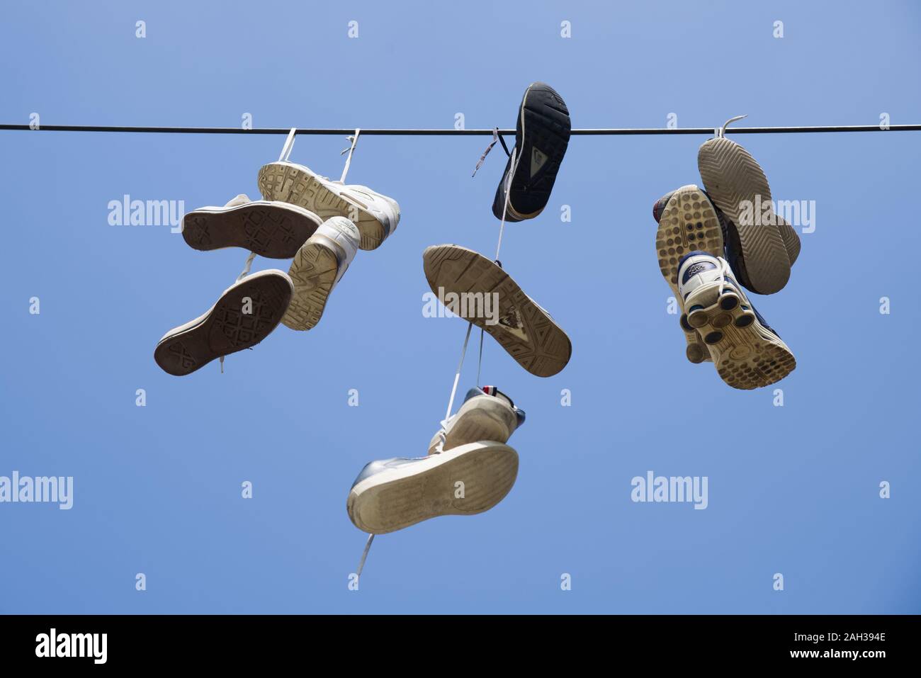 Milan Italy 17 April 2019: Shoefiti, shoes hanging from light cables at ...
