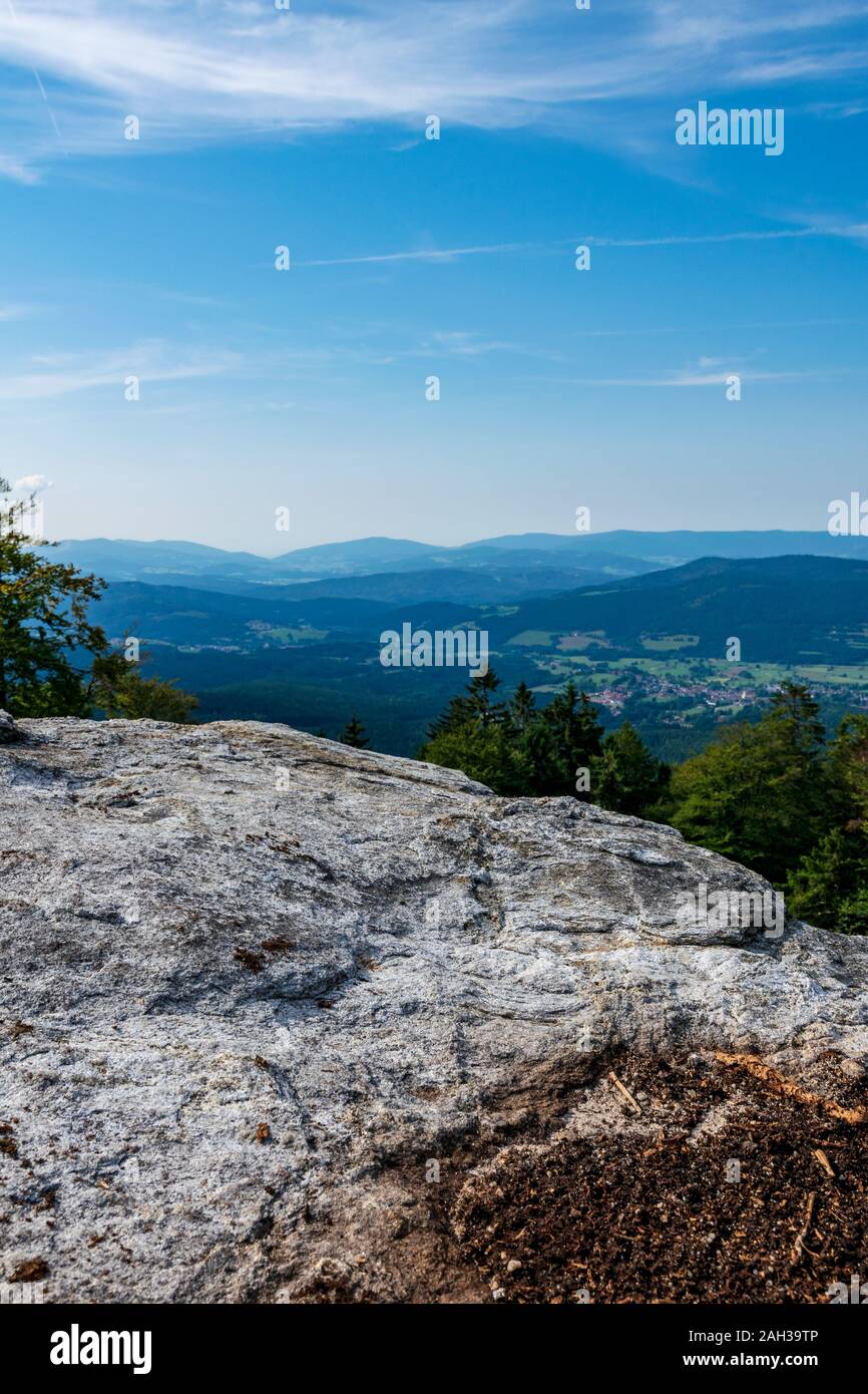Stone and Rocks in front of a great landscape with clouds on the sky in ...