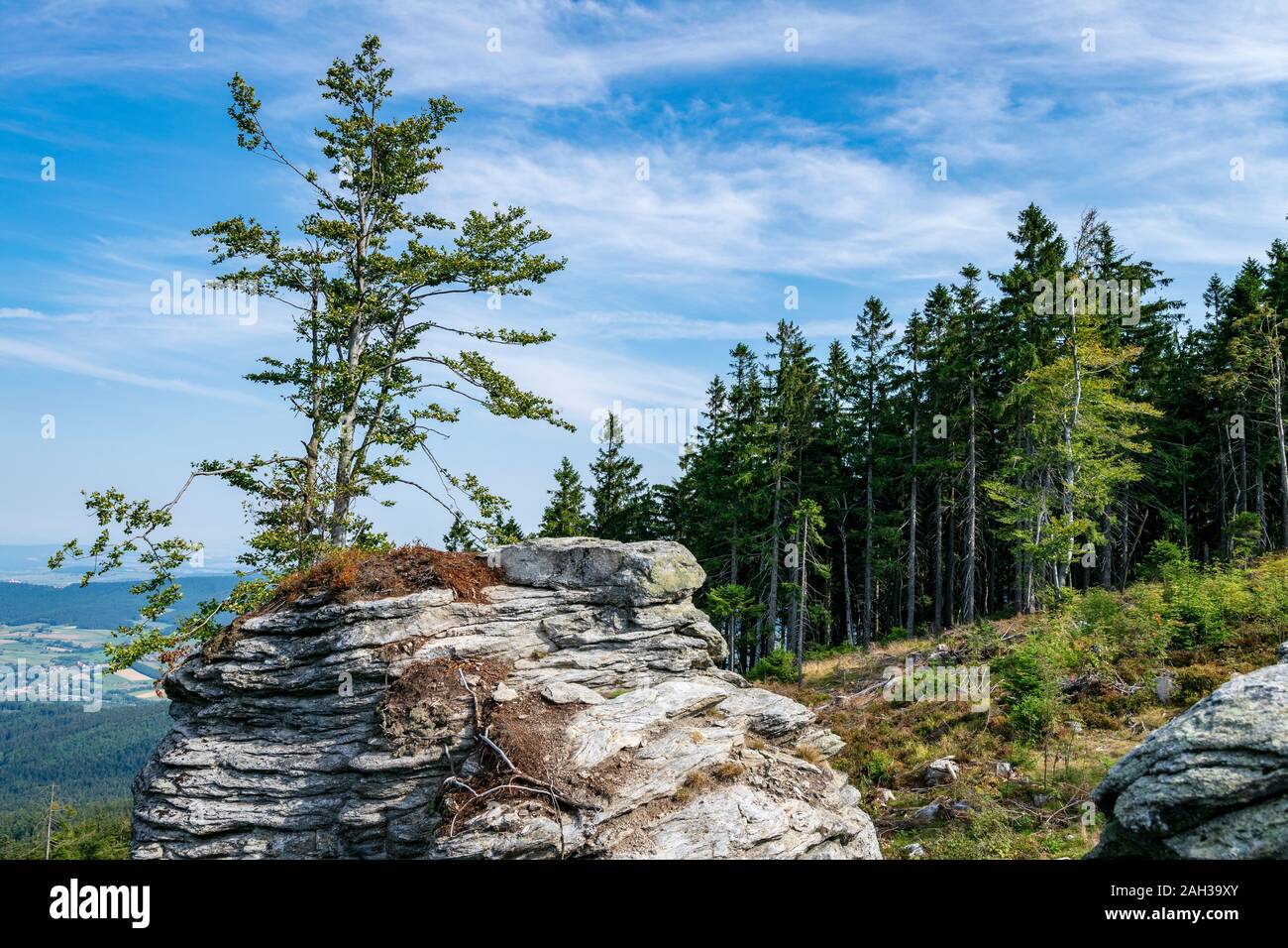 Stone and Rocks in front of a great landscape with clouds on the sky in ...