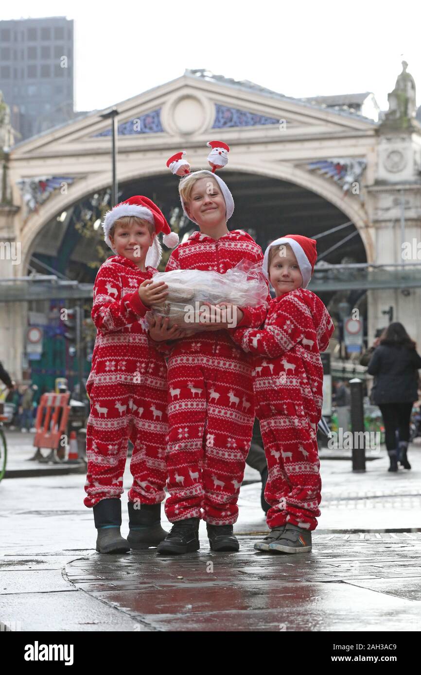 Evan Inglis, 7, Rhodri Inglis, 9, and Nye Inglis, 5, from London, leave ...