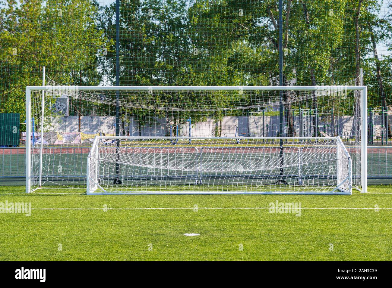 Two football gates of different size Stock Photo - Alamy