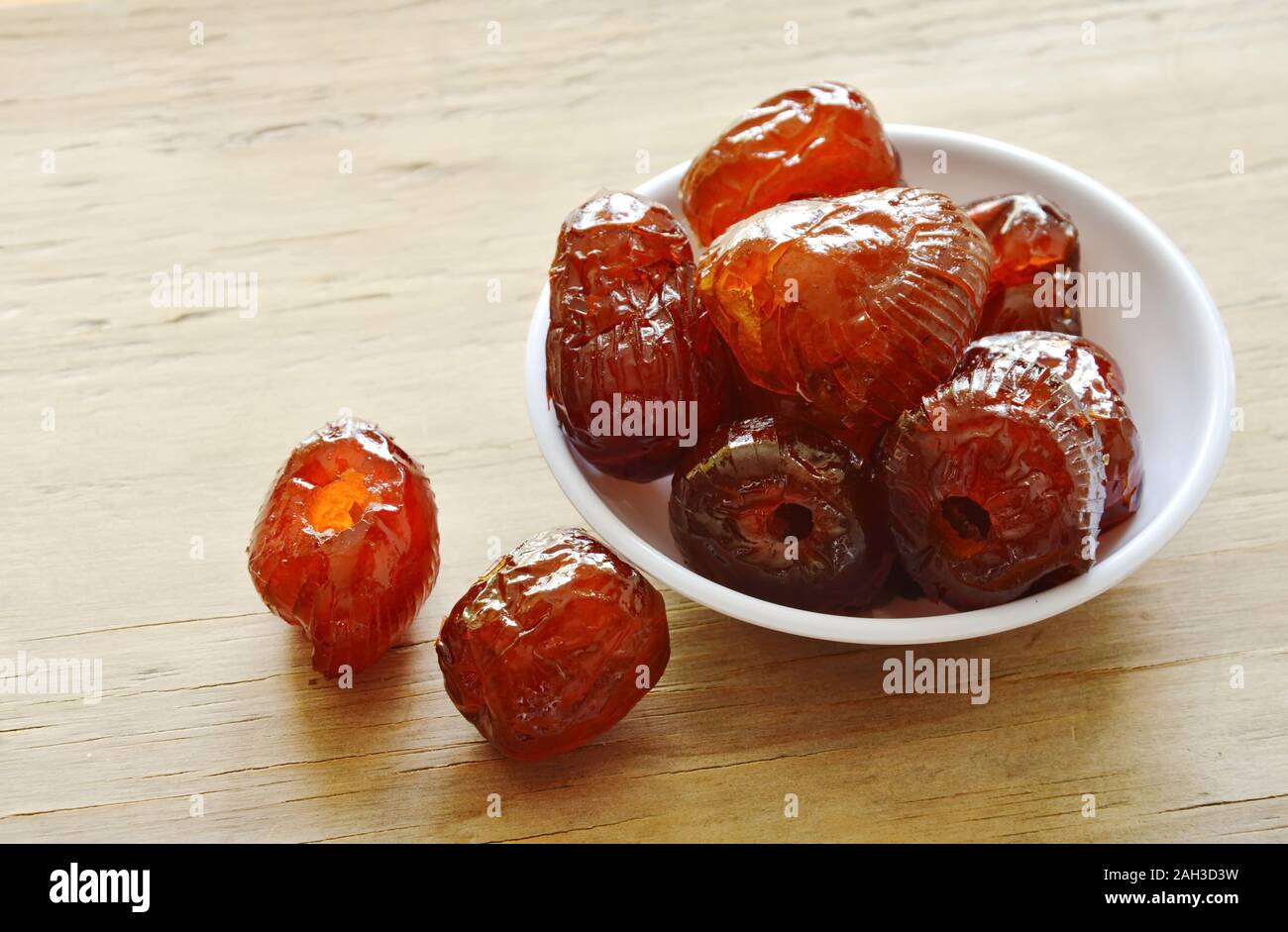 Chinese jujube candy coating syrup on little cup Stock Photo - Alamy