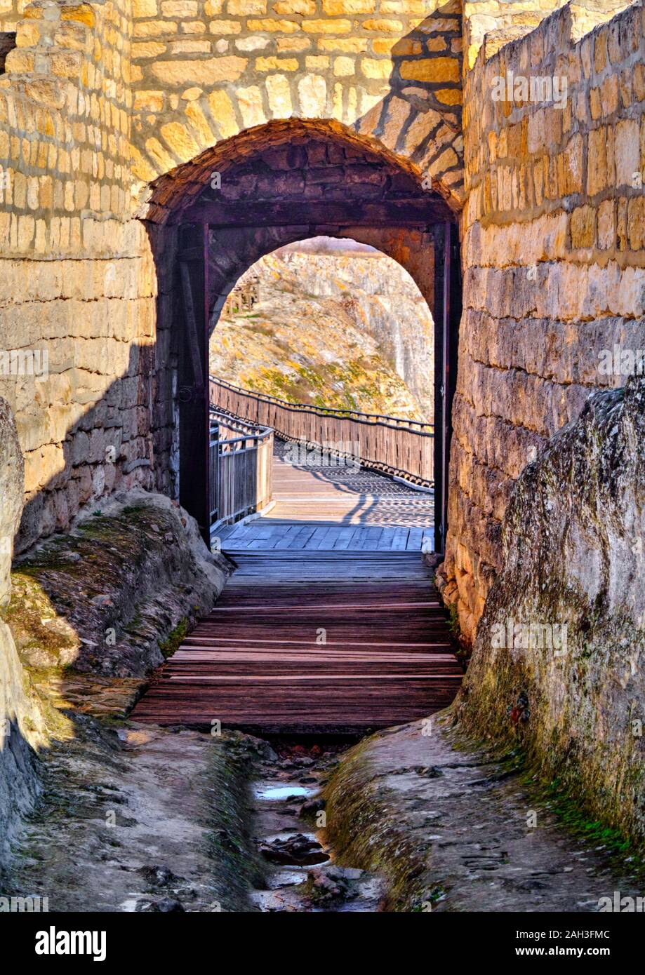 A look thru an opened stone gate of an ancient fortress Stock Photo - Alamy