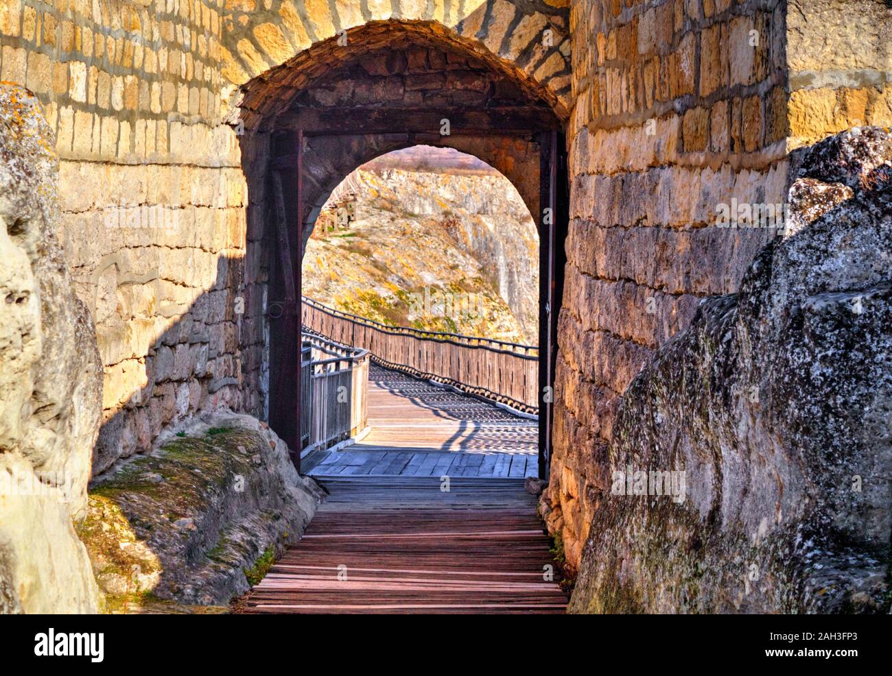 A look thru an opened stone gate of an ancient fortress Stock Photo - Alamy