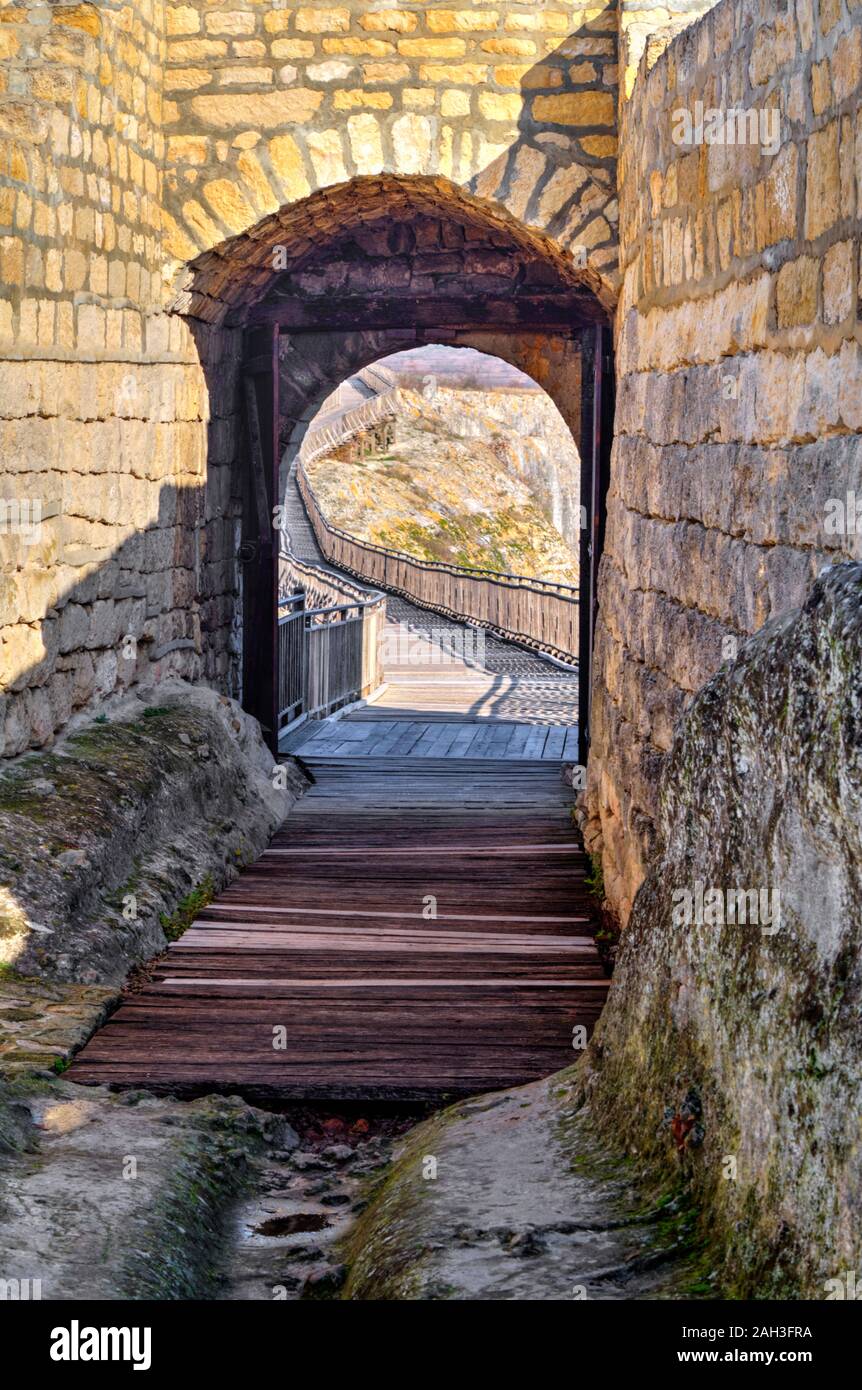 A look thru an opened stone gate of an ancient fortress Stock Photo - Alamy
