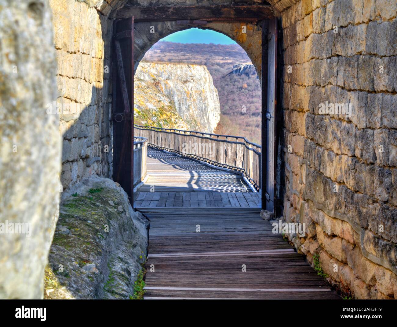 A look thru an opened stone gate of an ancient fortress Stock Photo - Alamy